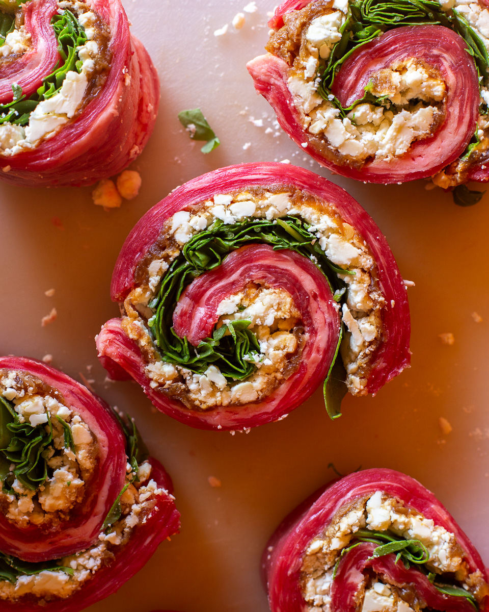 Flank Steak Rolls Stuffed with Arugula, Caramelized Onion, and Feta ...