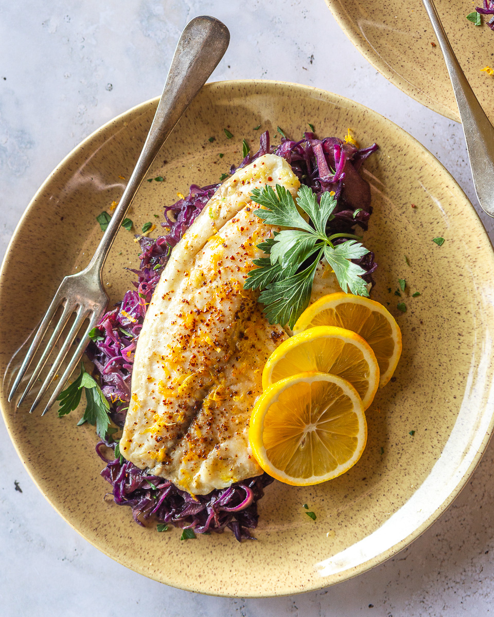 Lemon and Garlic Fish Over Sautéed Cabbage – Primal Wellness